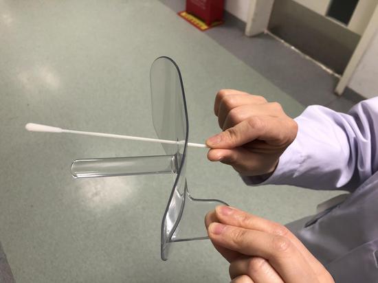 Chinese nurses invent throat swab sampling shield to reduce droplet ...