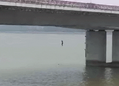 Man leaps off bridge to rescue woman